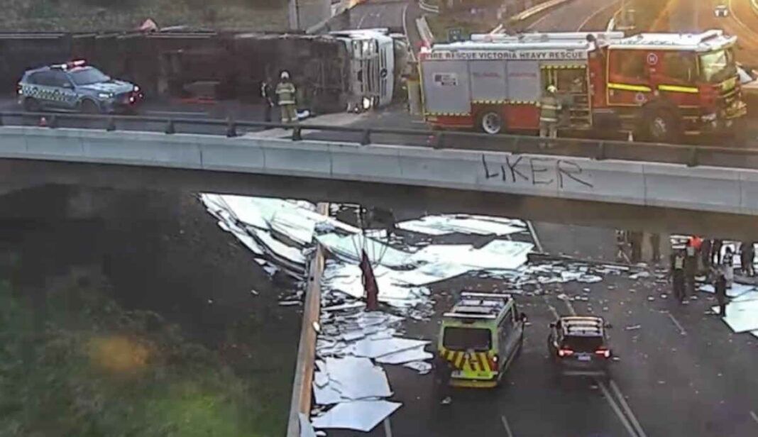 Truck driver injured after rollover shuts major Melbourne freeway ...